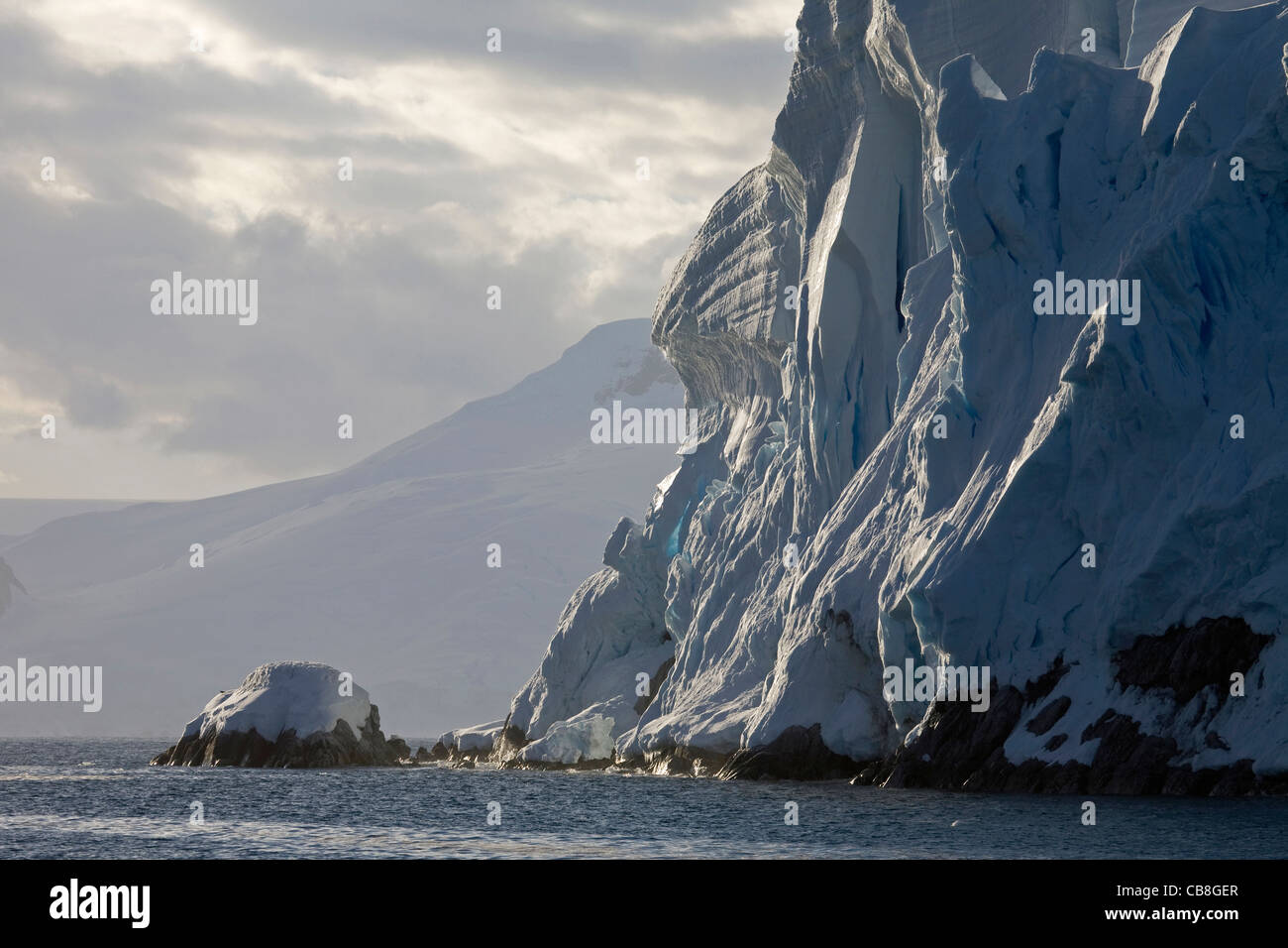 Antarctic sea and crumbling wall of ice from glacier at Antarctica ...
