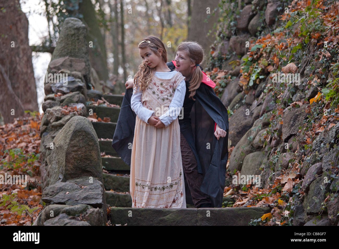 two young girls playing vampire and girl Stock Photo - Alamy