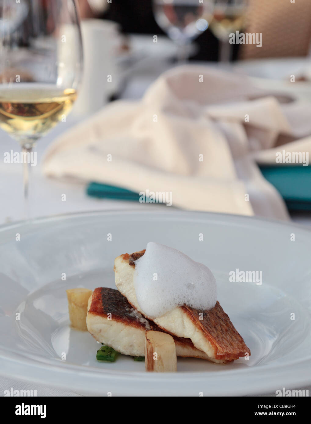 Sama fish fillets grilled and served with white asparagus and a lime ...