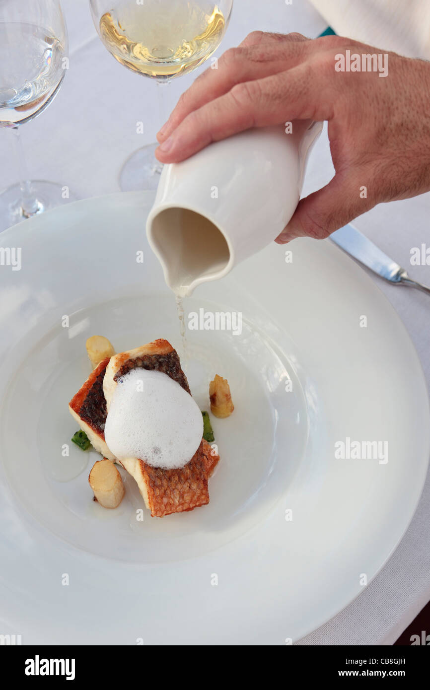 Sama fish fillets grilled and served with white asparagus and a lime ...