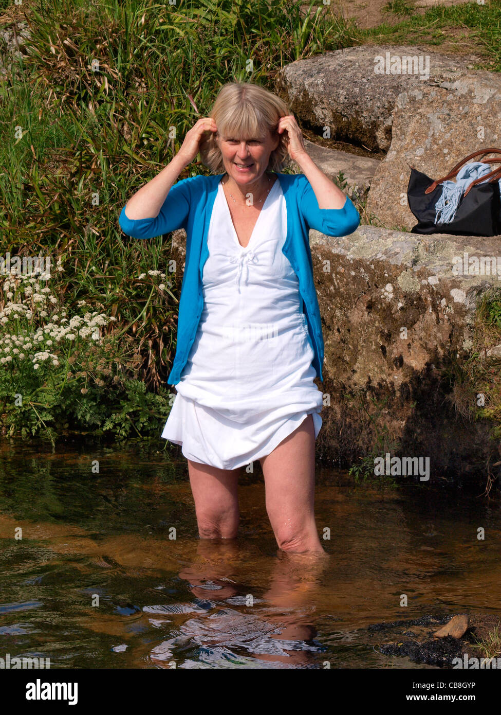 Woman in dress wading in water hi-res stock photography and images - Alamy