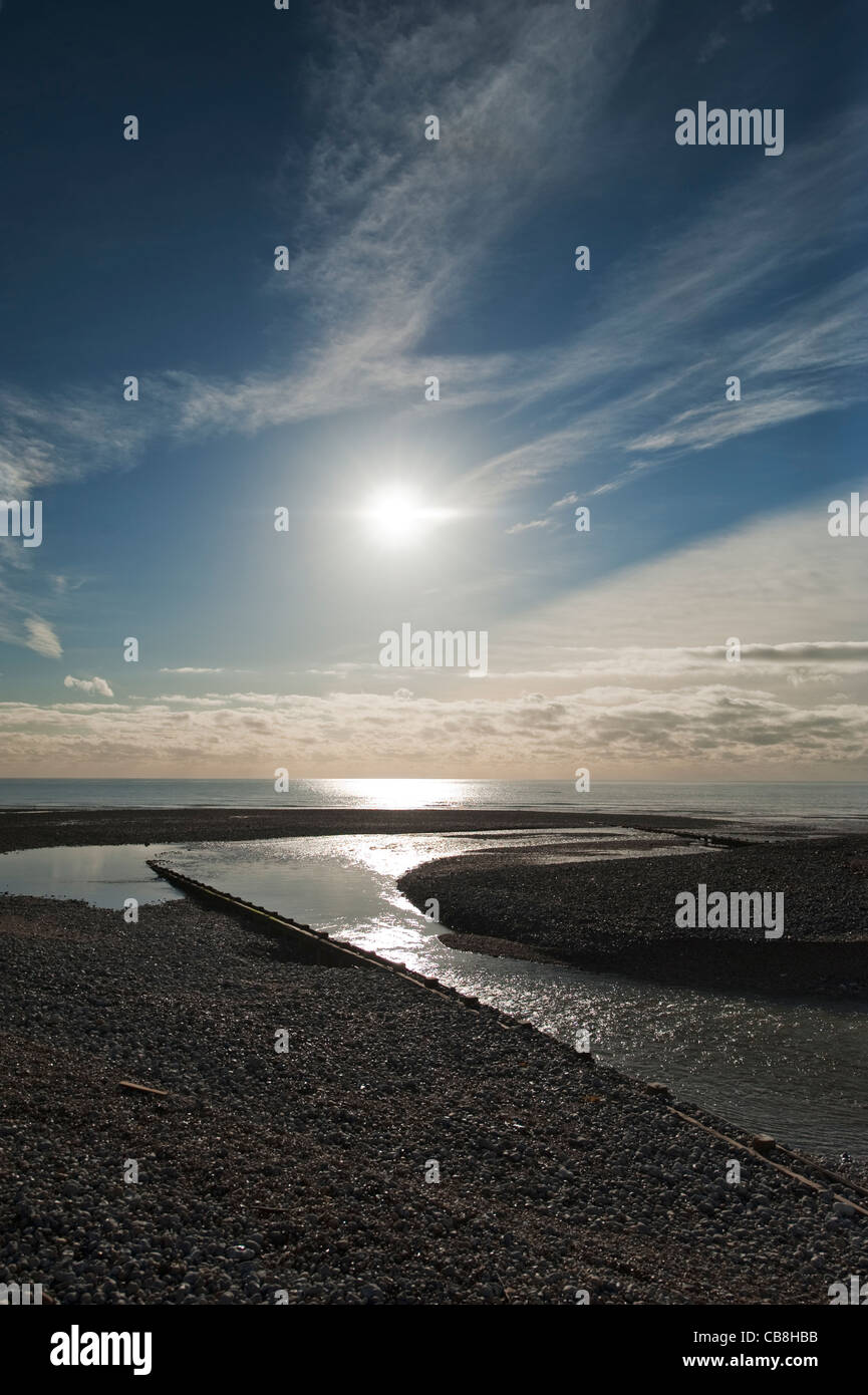 The River Cuckmere entering the sea at Cuckmere Haven in Sussex ...