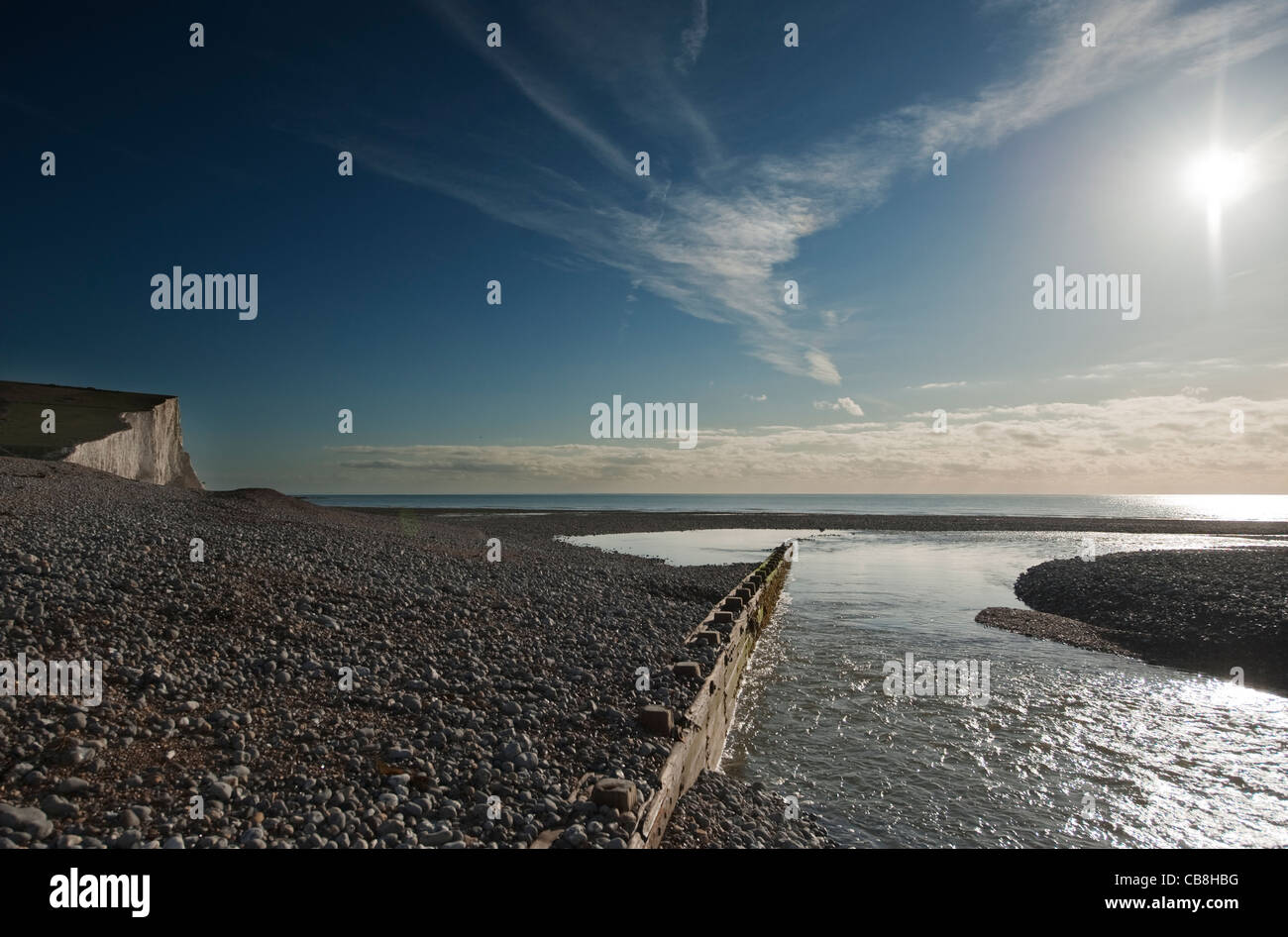 The River Cuckmere entering the sea at Cuckmere Haven in Sussex ...