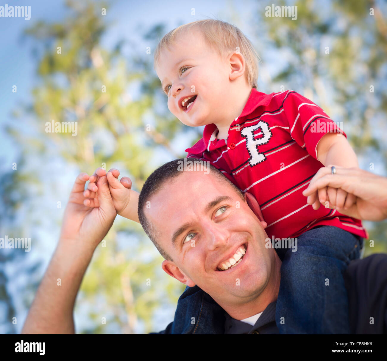 Young Laughing Father and Child Having Piggy Back Fun Stock Photo - Alamy