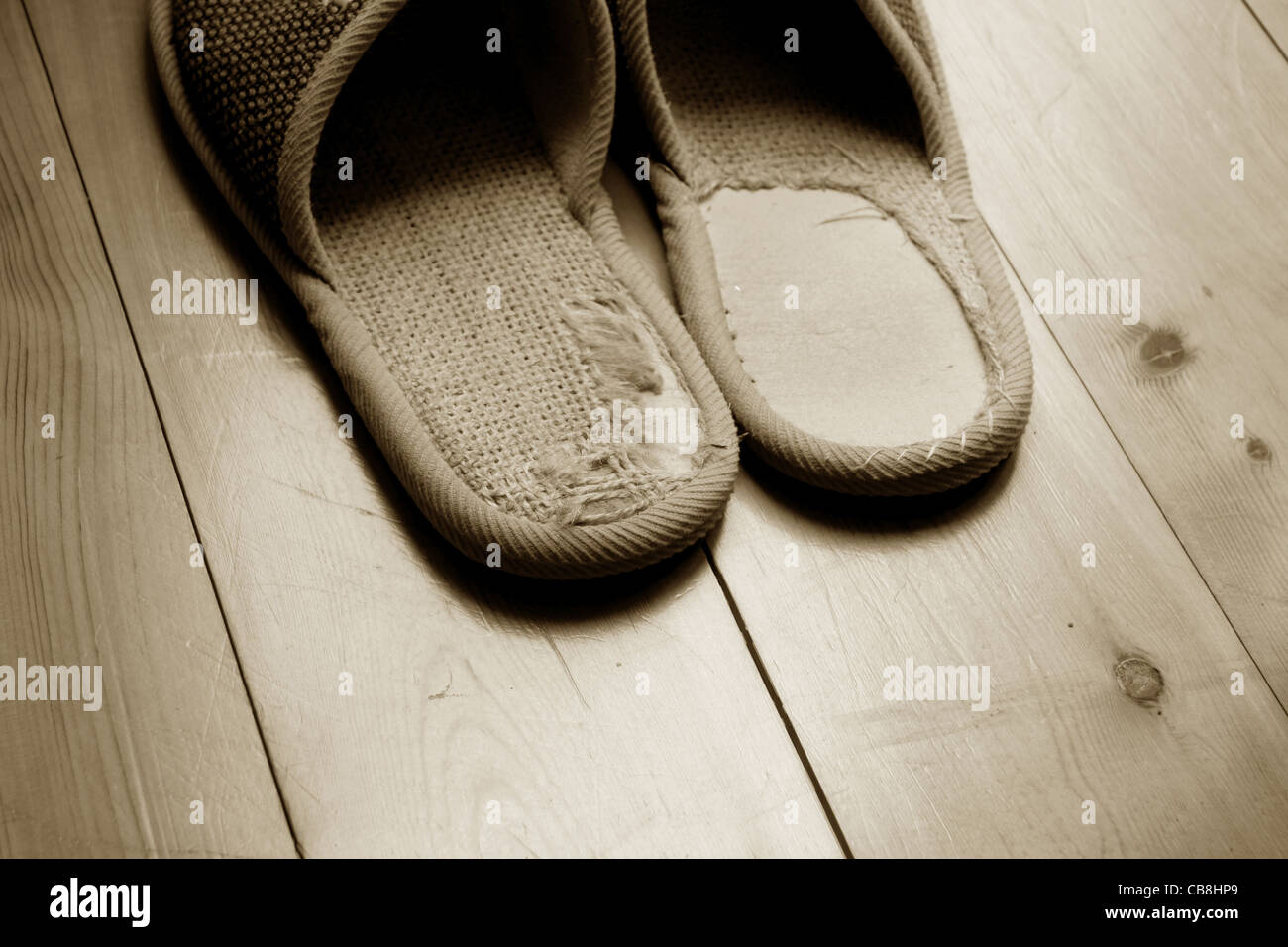 old slipper on the floor close up Stock Photo - Alamy