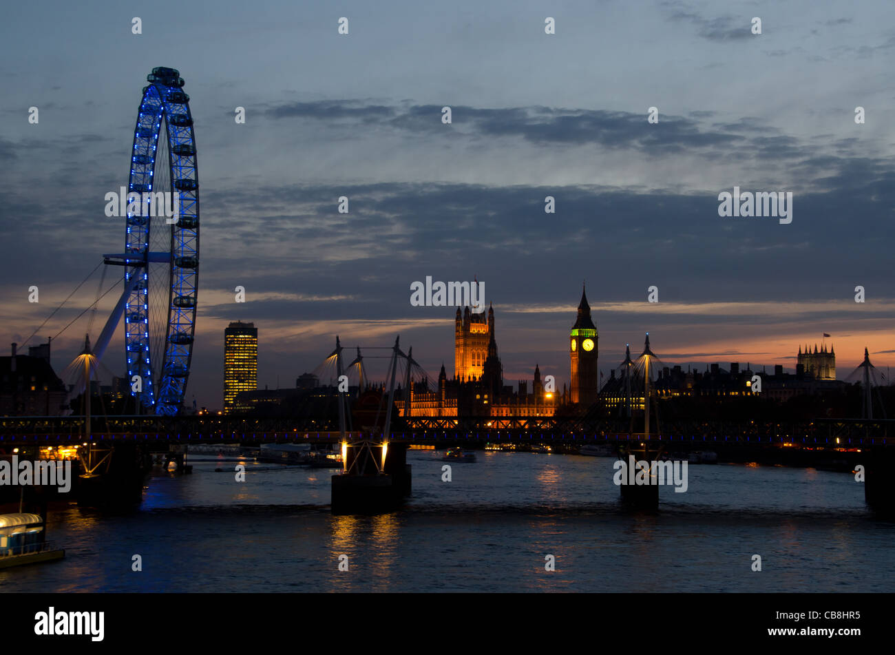 London skyline at sunset with view of Thames, Houses of Parliament ...