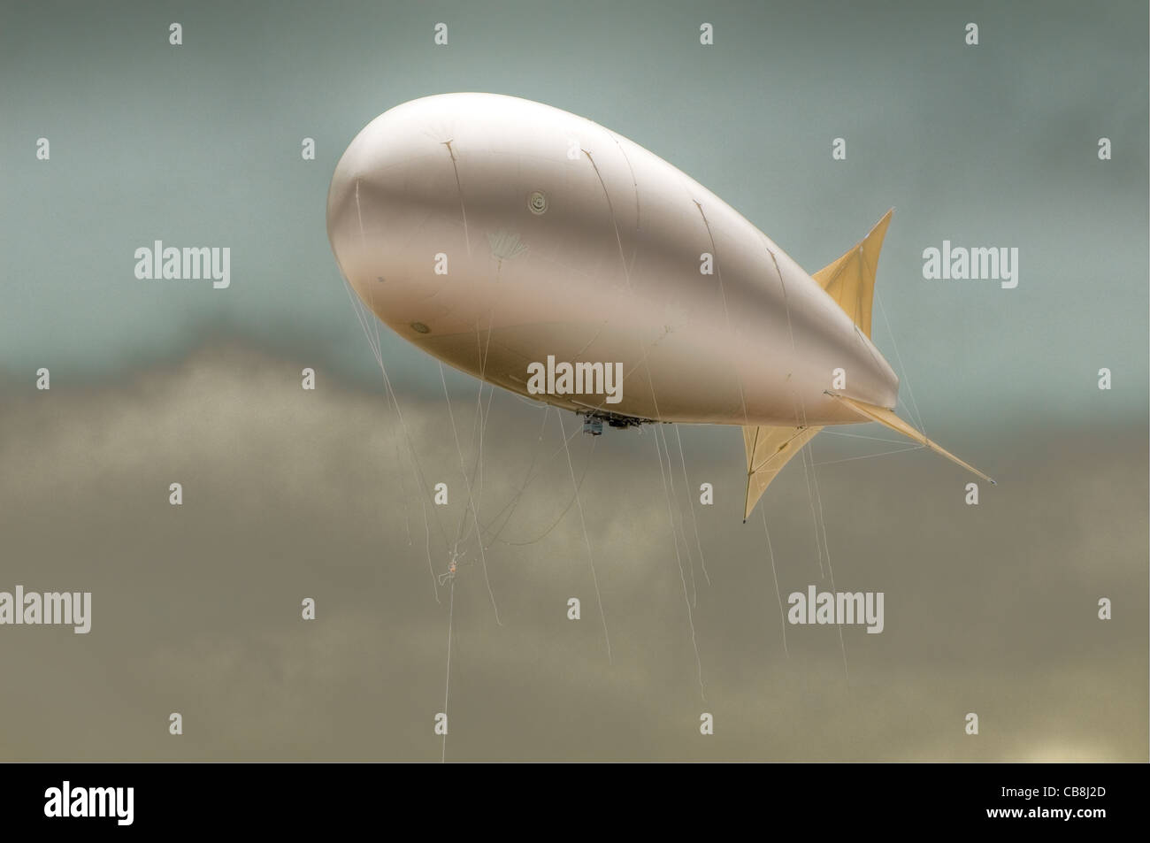 big dirigible flying in the dramatic looking sky Stock Photo - Alamy