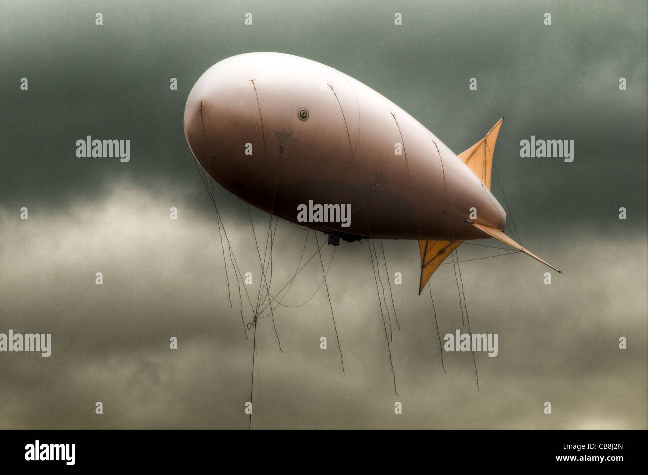 big dirigible flying in the dramatic looking sky Stock Photo - Alamy