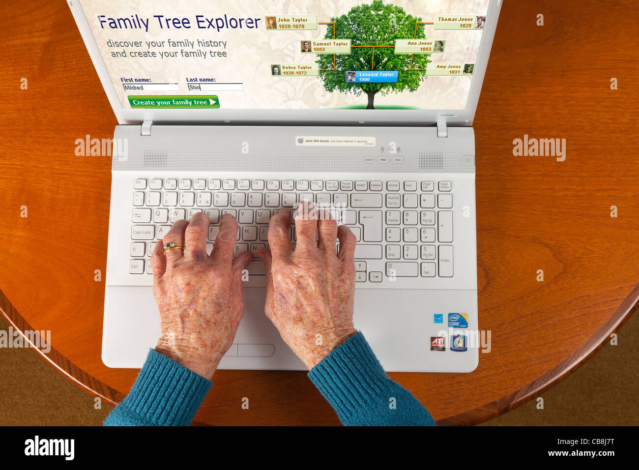 Female elderly hand using a laptop to check the family tree via the internet Stock Photo - Alamy