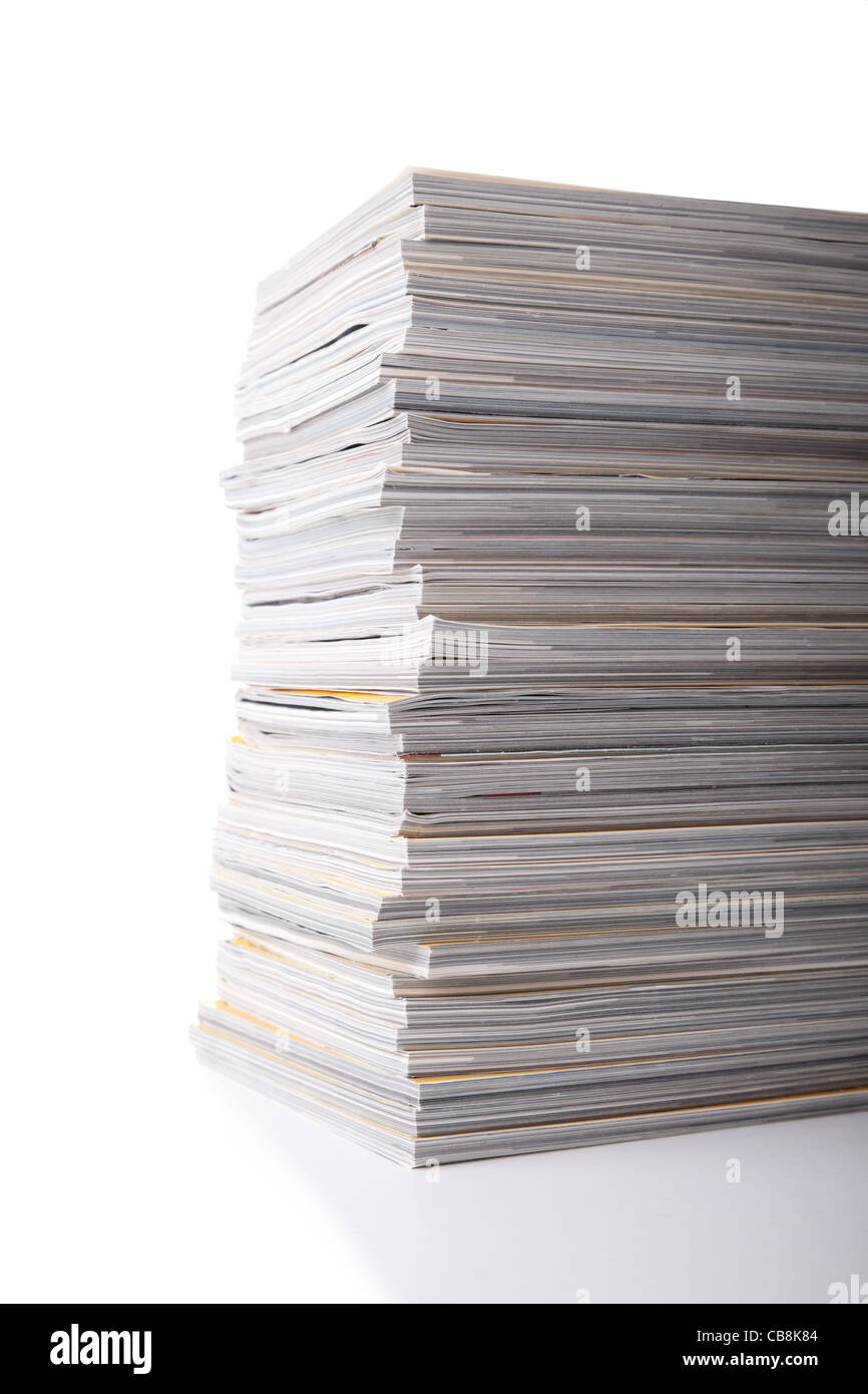 Stack of magazines isolated on white with reflection Stock Photo - Alamy