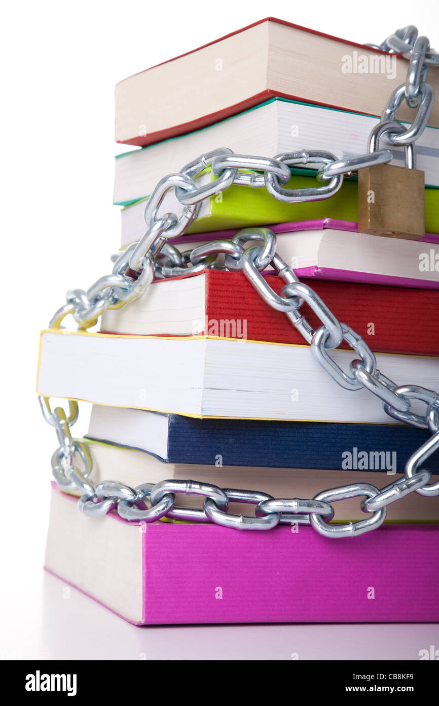 stack of colorful books protected with a chain (over a white background ...
