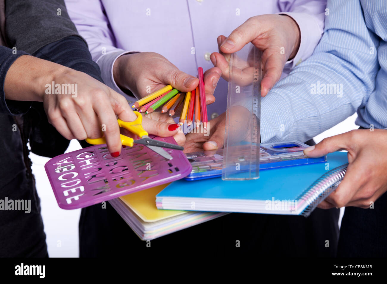 Group of hands holding education objects (selective focus Stock Photo ...