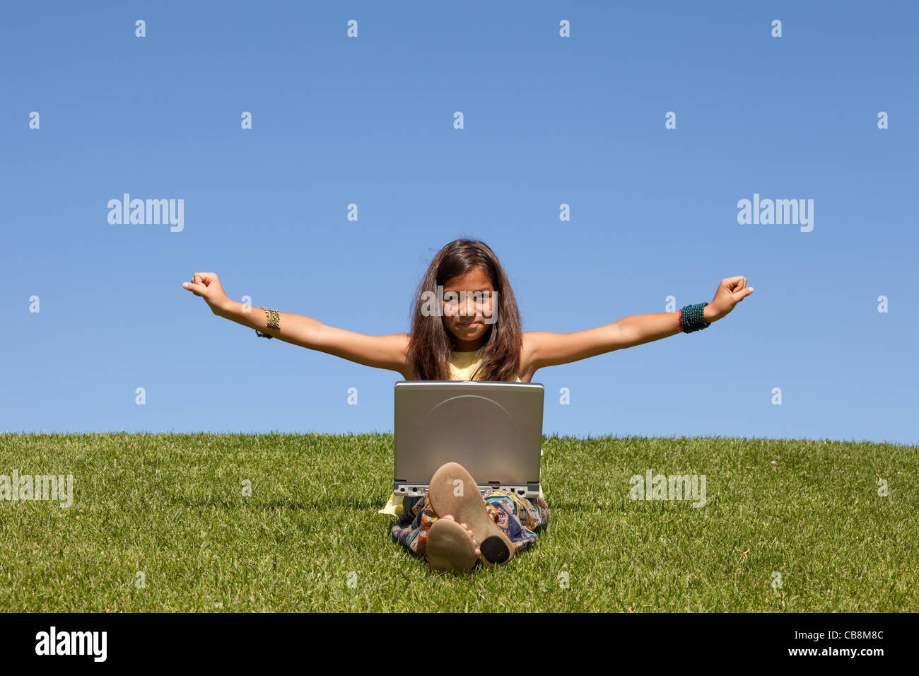 Young girl using wireless internet at the park Stock Photo - Alamy