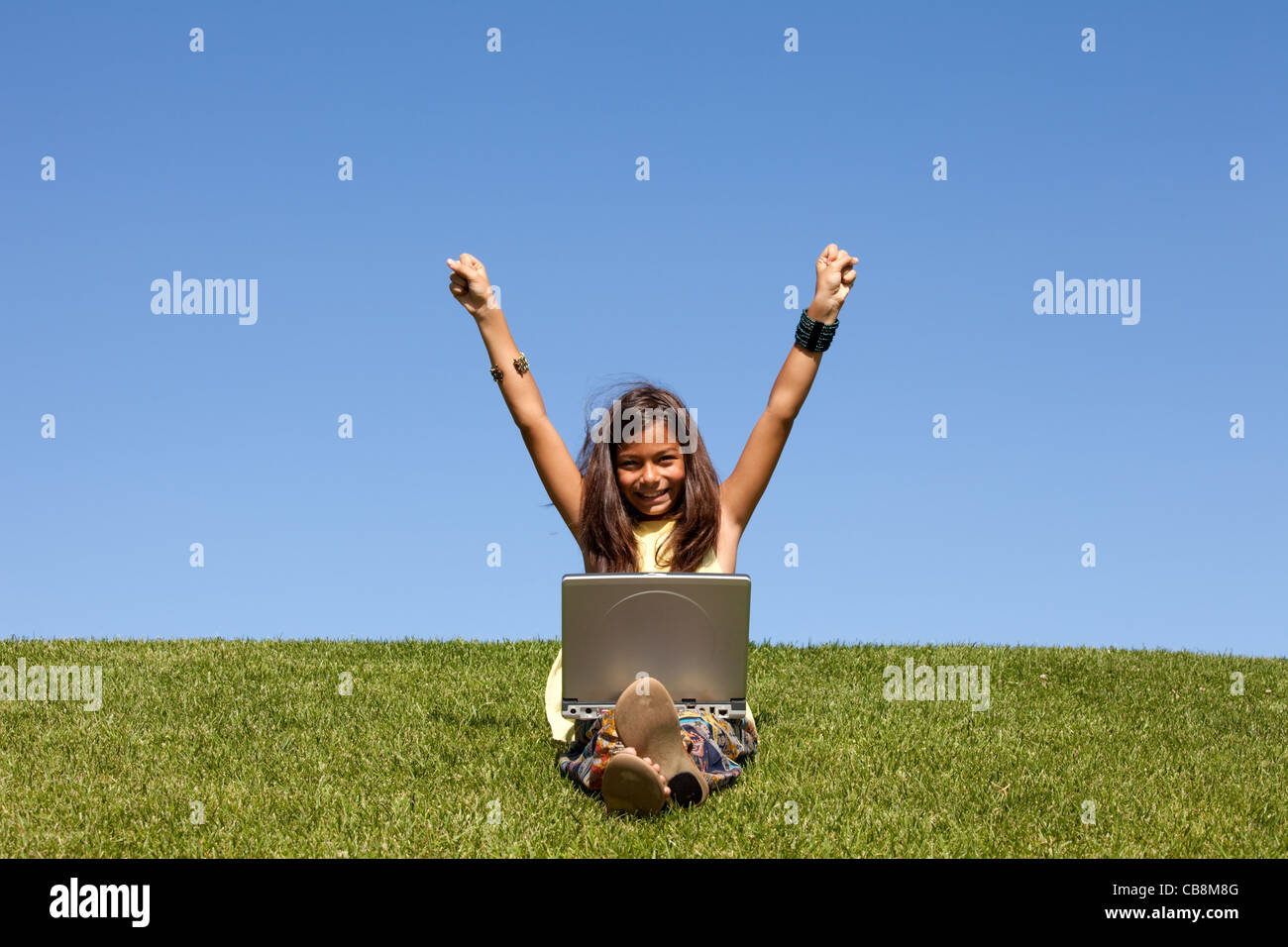 Young girl using wireless internet at the park Stock Photo - Alamy