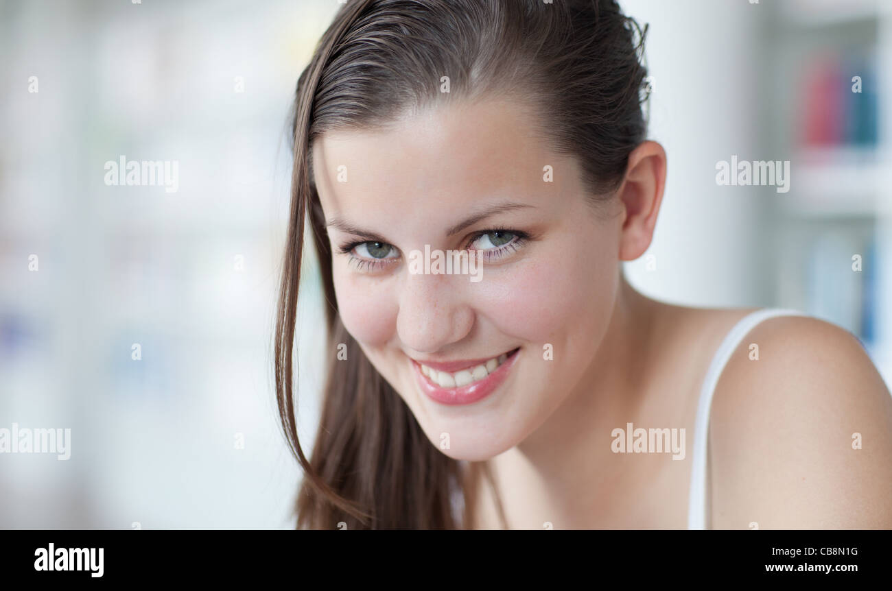 close-up portrait of a pretty female college student studying in the ...
