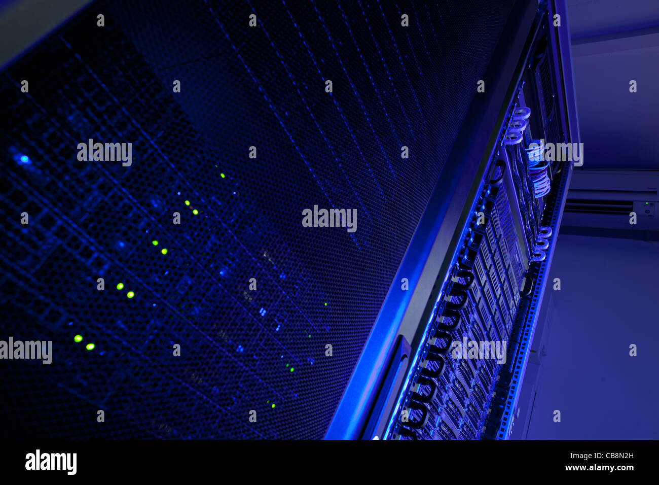 Server rack cluster in a data center (shallow DOF; color toned image ...