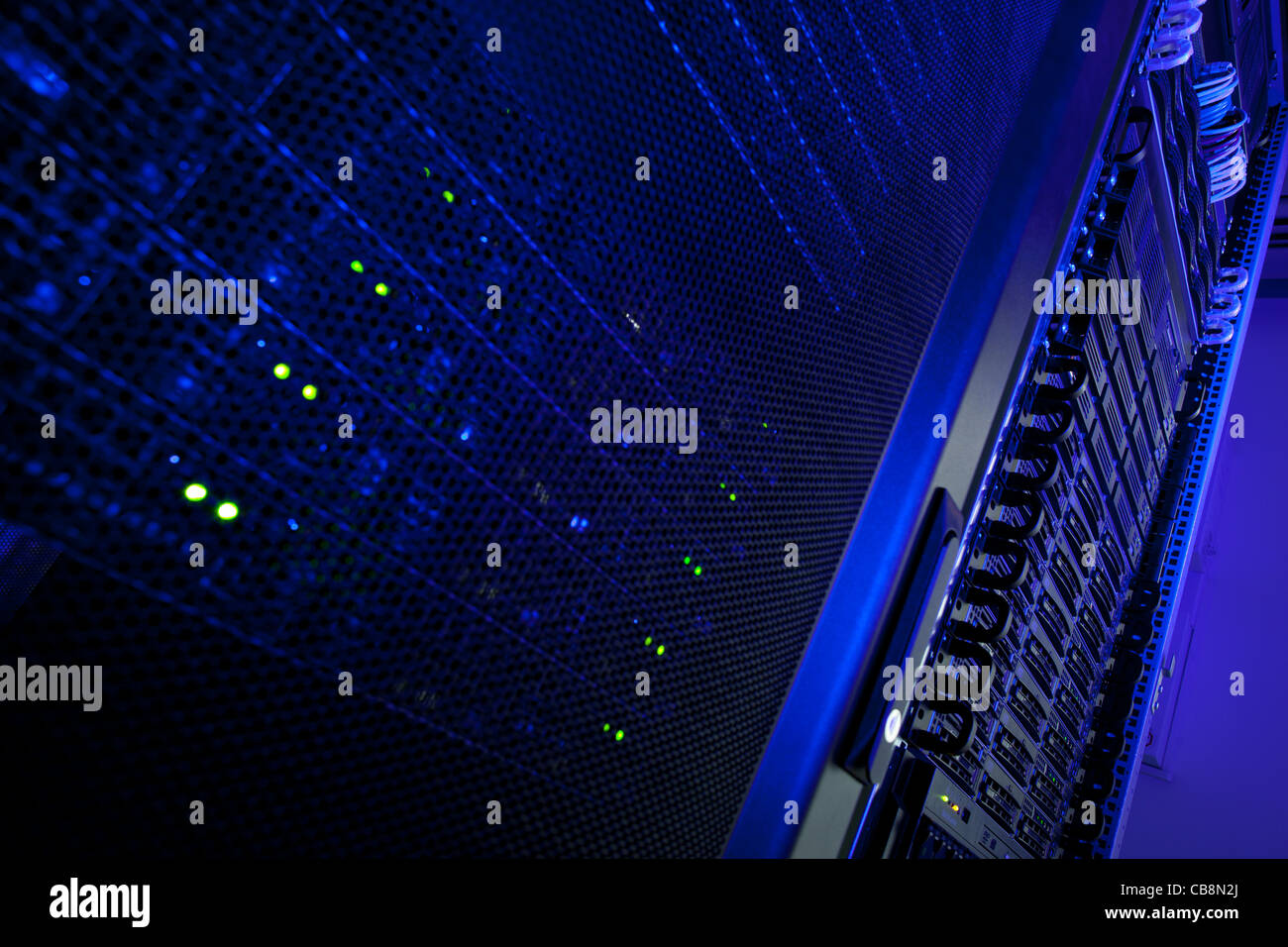 Server rack cluster in a data center (shallow DOF; color toned image ...