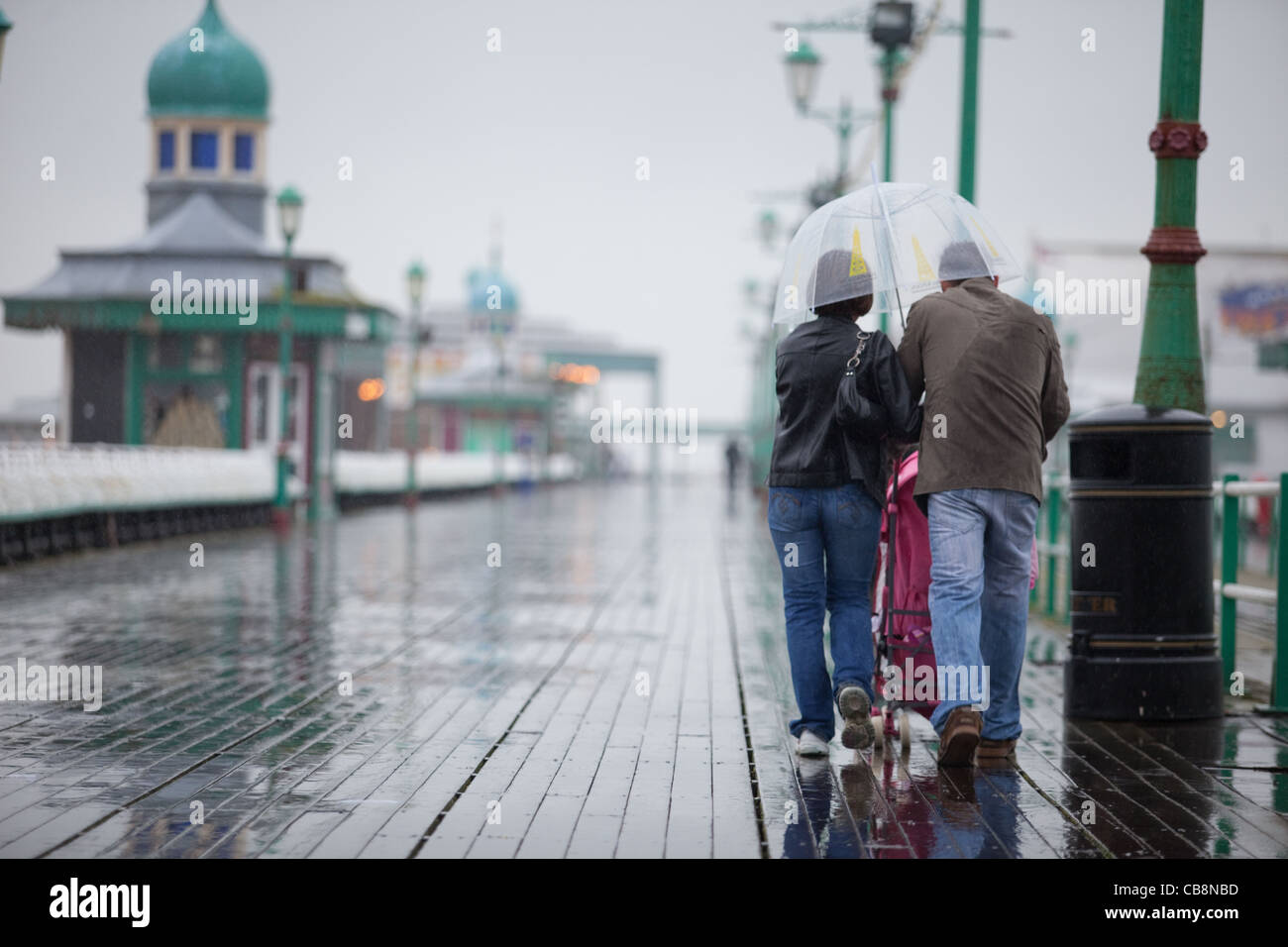 Blackpool Pier in the rain on a cold and wet summers day Stock Photo ...