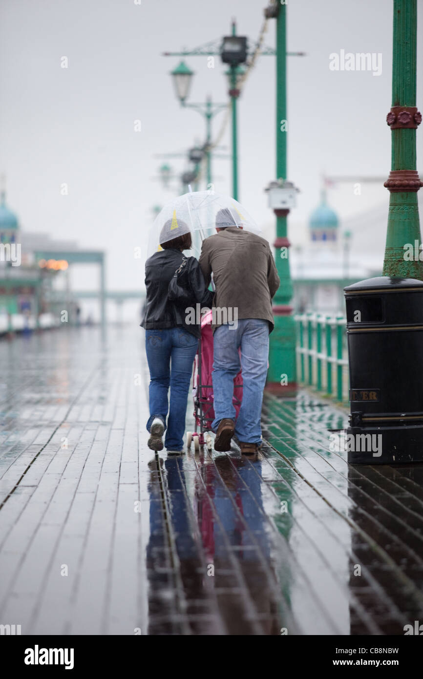 Blackpool Pier in the rain on a cold and wet summers day Stock Photo ...