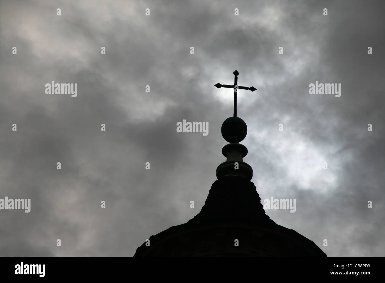 cross on church top with moody sky in rome italy Stock Photo - Alamy