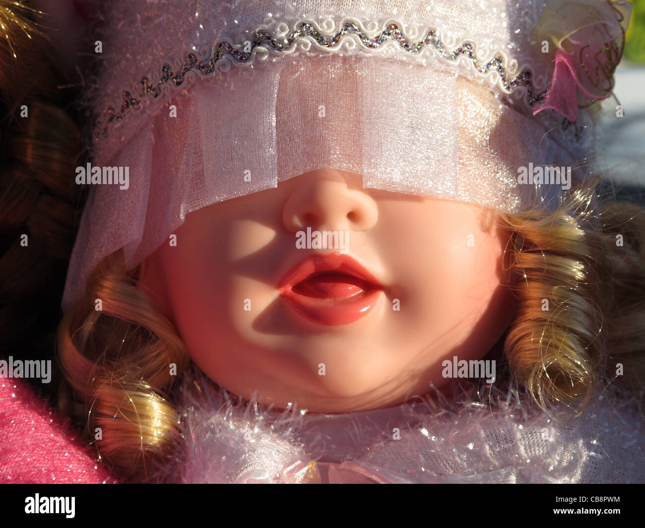 Dolls girl woman toy market stall stand hat cap lonely hi-res stock ...