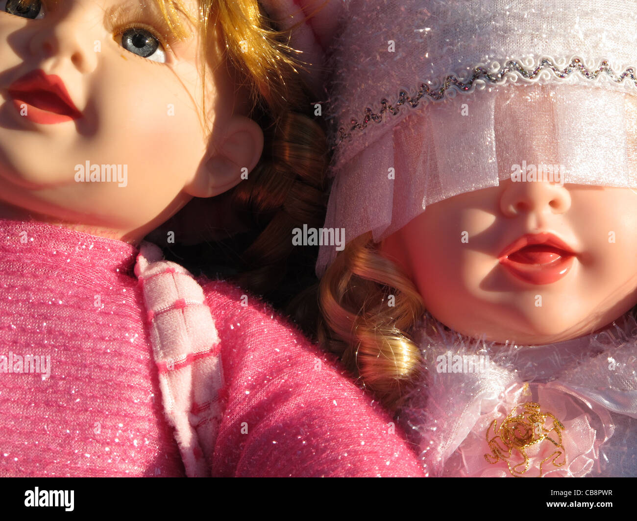 Dolls girl woman toy market stall stand hat cap lonely hi-res stock ...