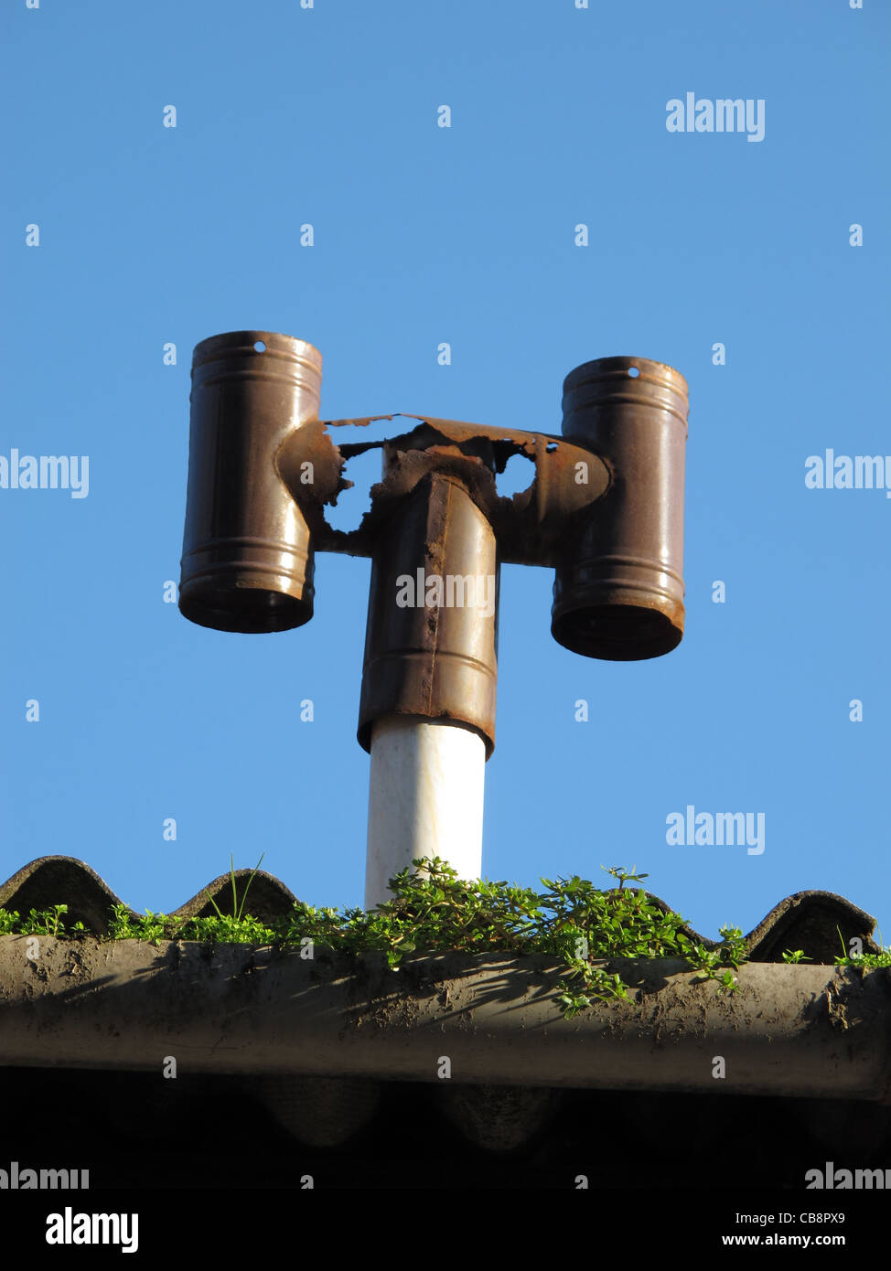 old rusted chimney flue on roof Stock Photo - Alamy