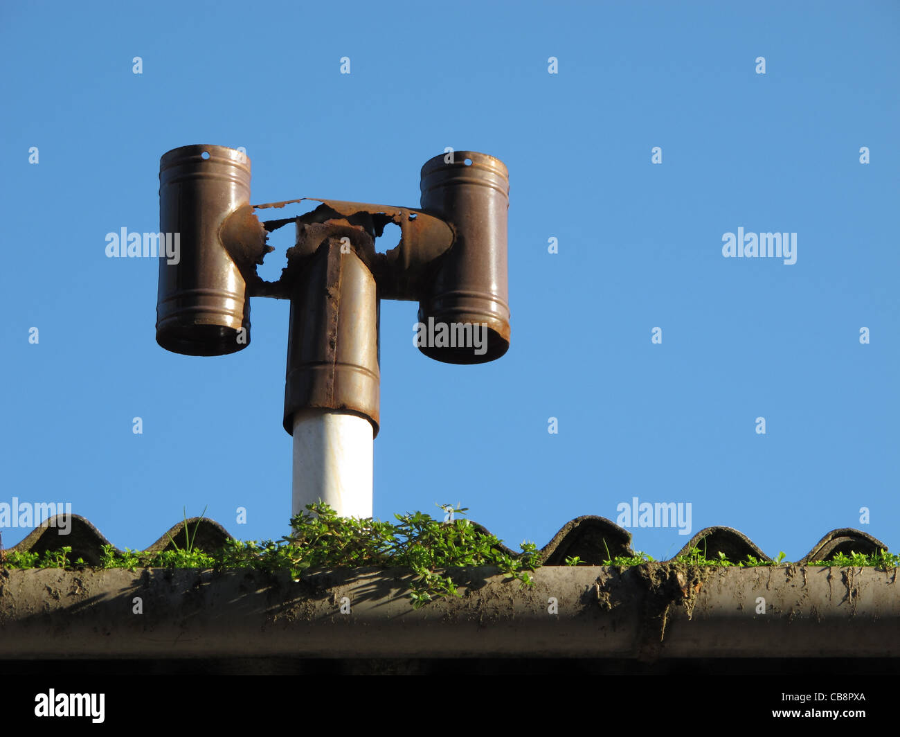 old rusted chimney flue on roof Stock Photo - Alamy