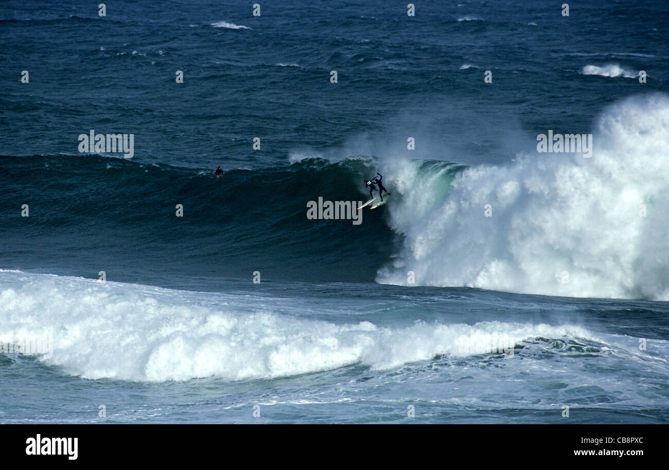 Two surfers surfing a big wave. Papatowai, South Otago, Catlins, New ...
