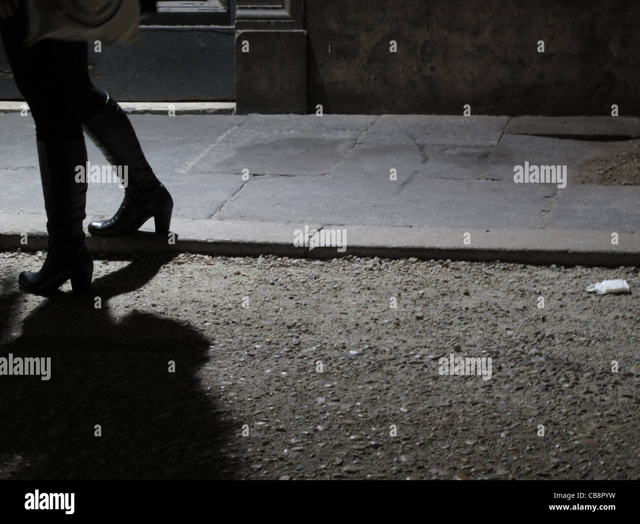 Silhouette man walking down alleyway hi-res stock photography and ...