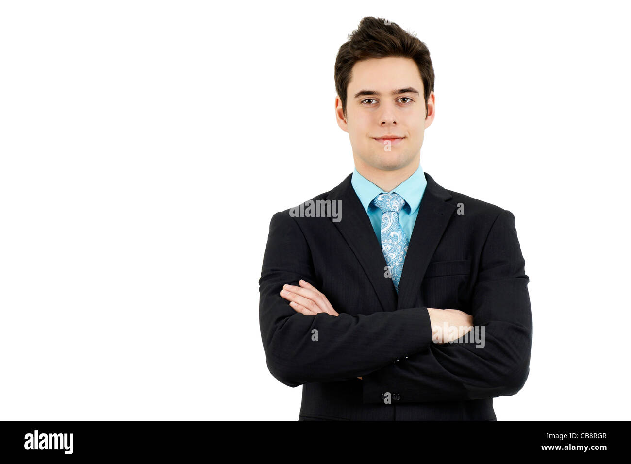 Handsome young man in a formal business suit with arms crossed Stock ...