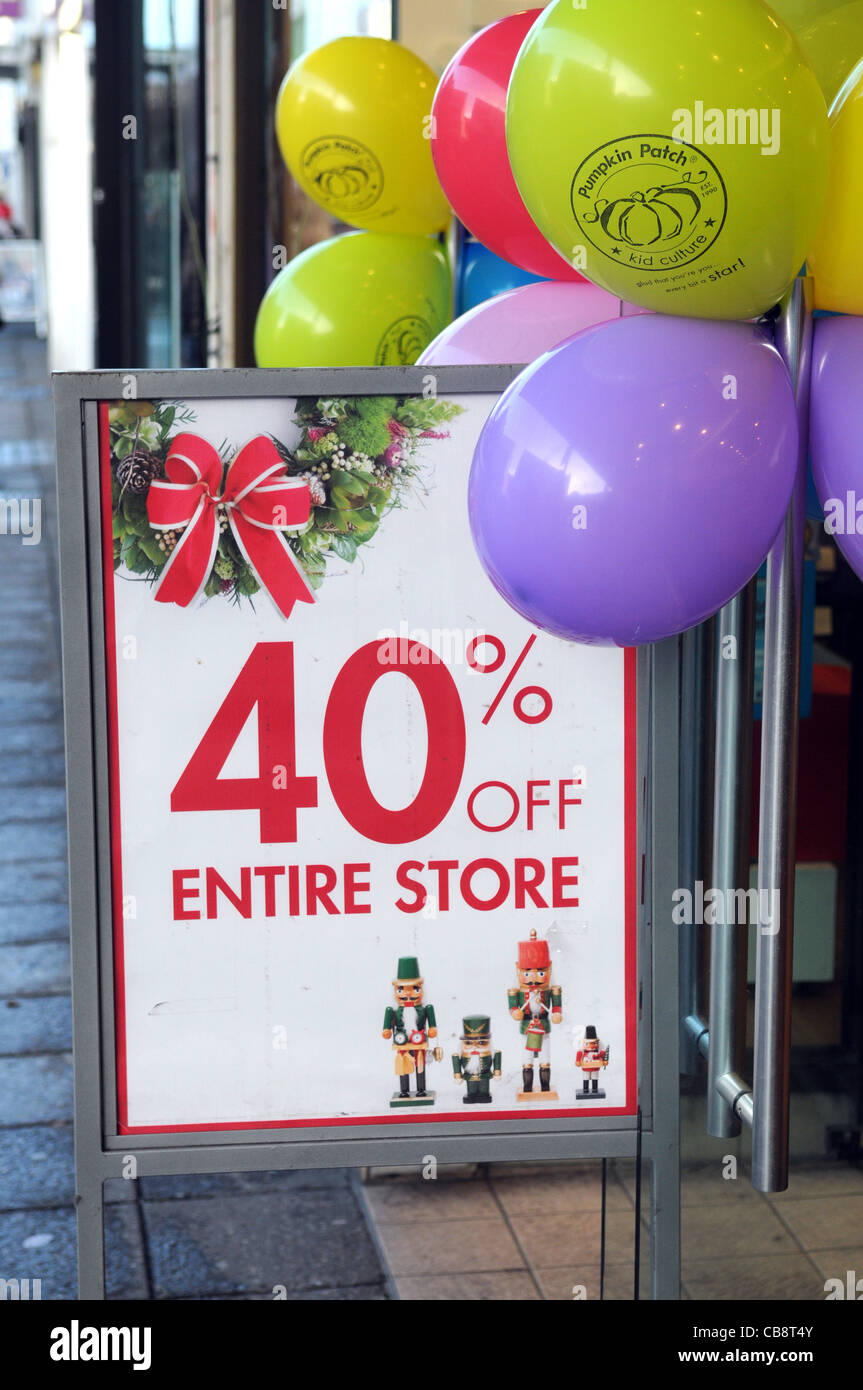 Discount sign in shop window Stock Photo - Alamy