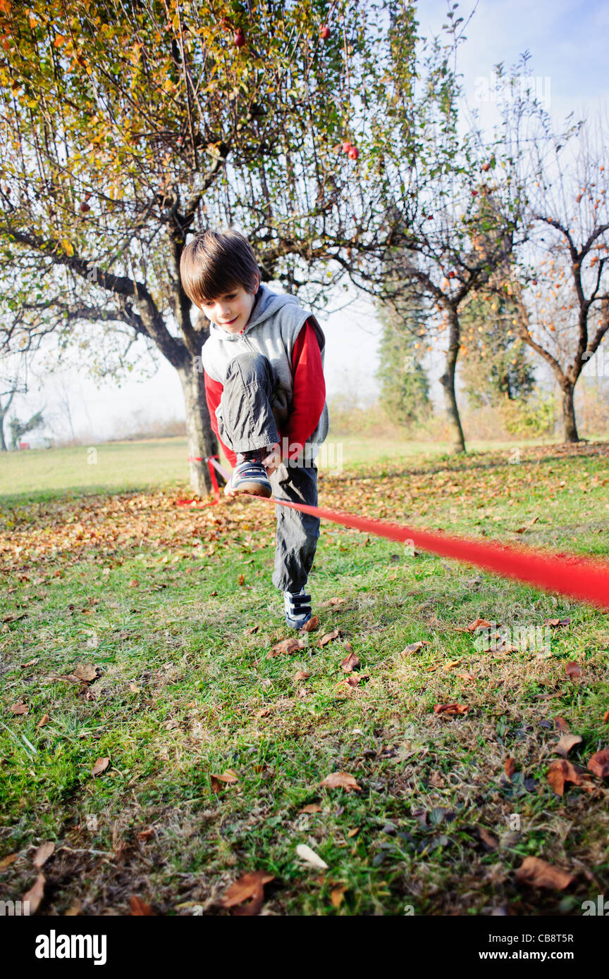 children walk on slackline Stock Photo - Alamy