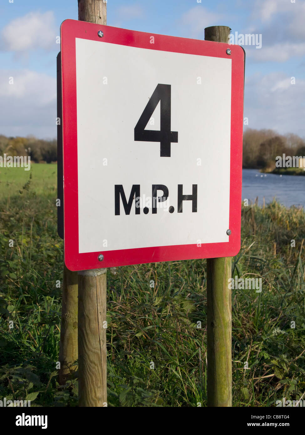 A 4MPH speed limit sign on the bank of a river Stock Photo - Alamy