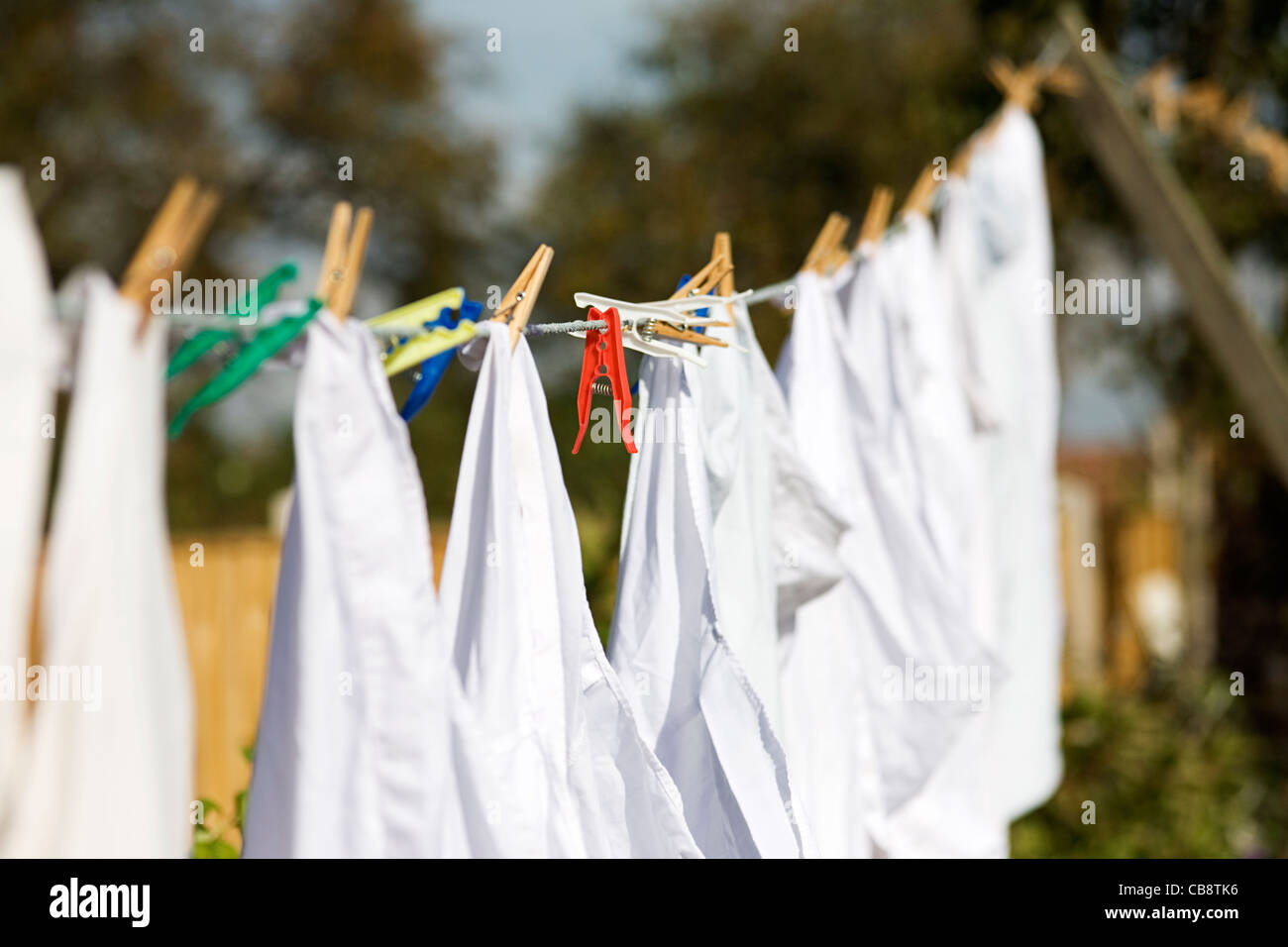 White Washing Pegged to Line Red Peg Stock Photo - Alamy