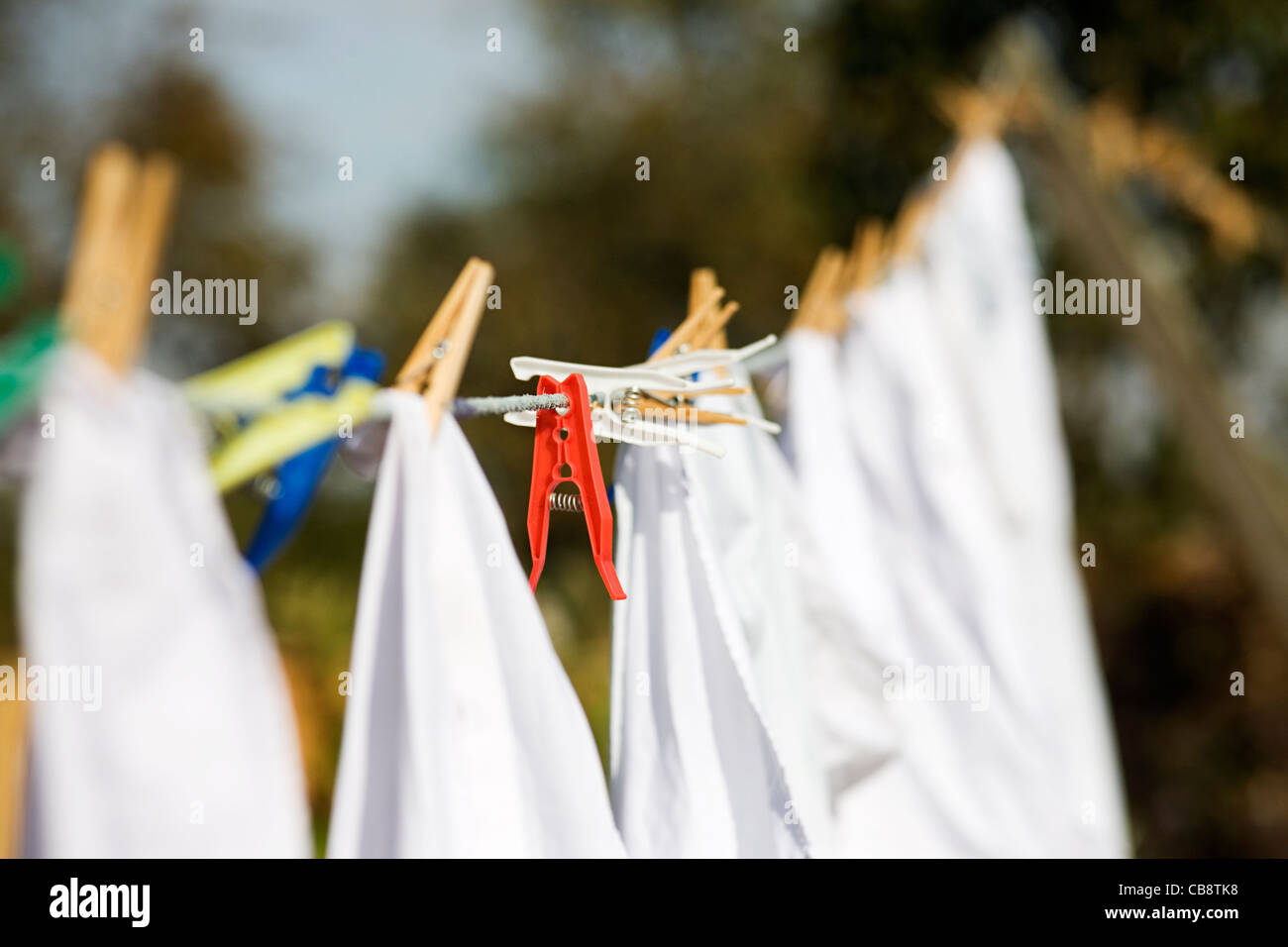 White Washing Pegged to Line Red Peg Stock Photo - Alamy