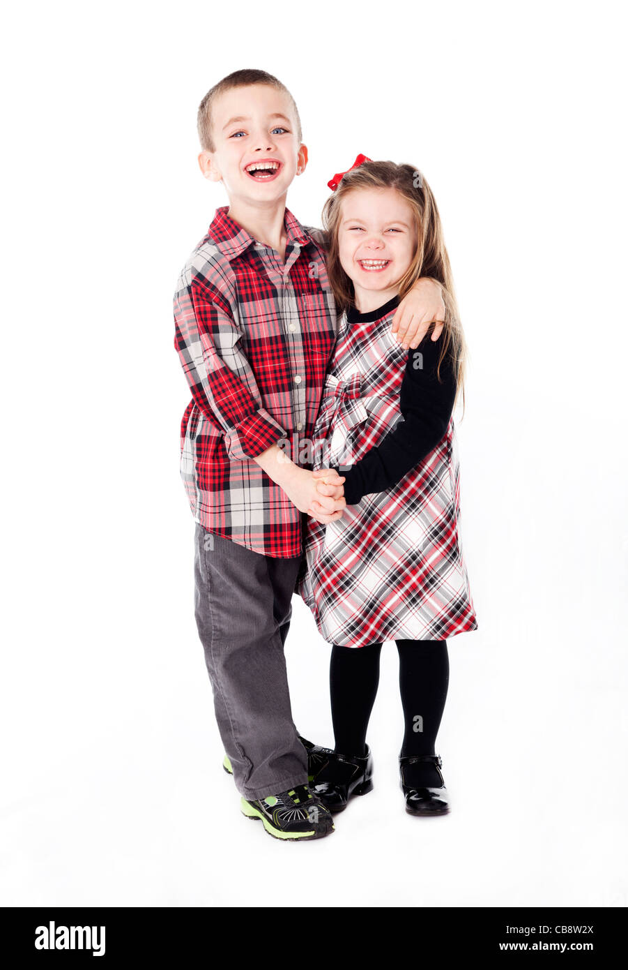 Happy brother sister hug in Cut Out Stock Images & Pictures - Alamy