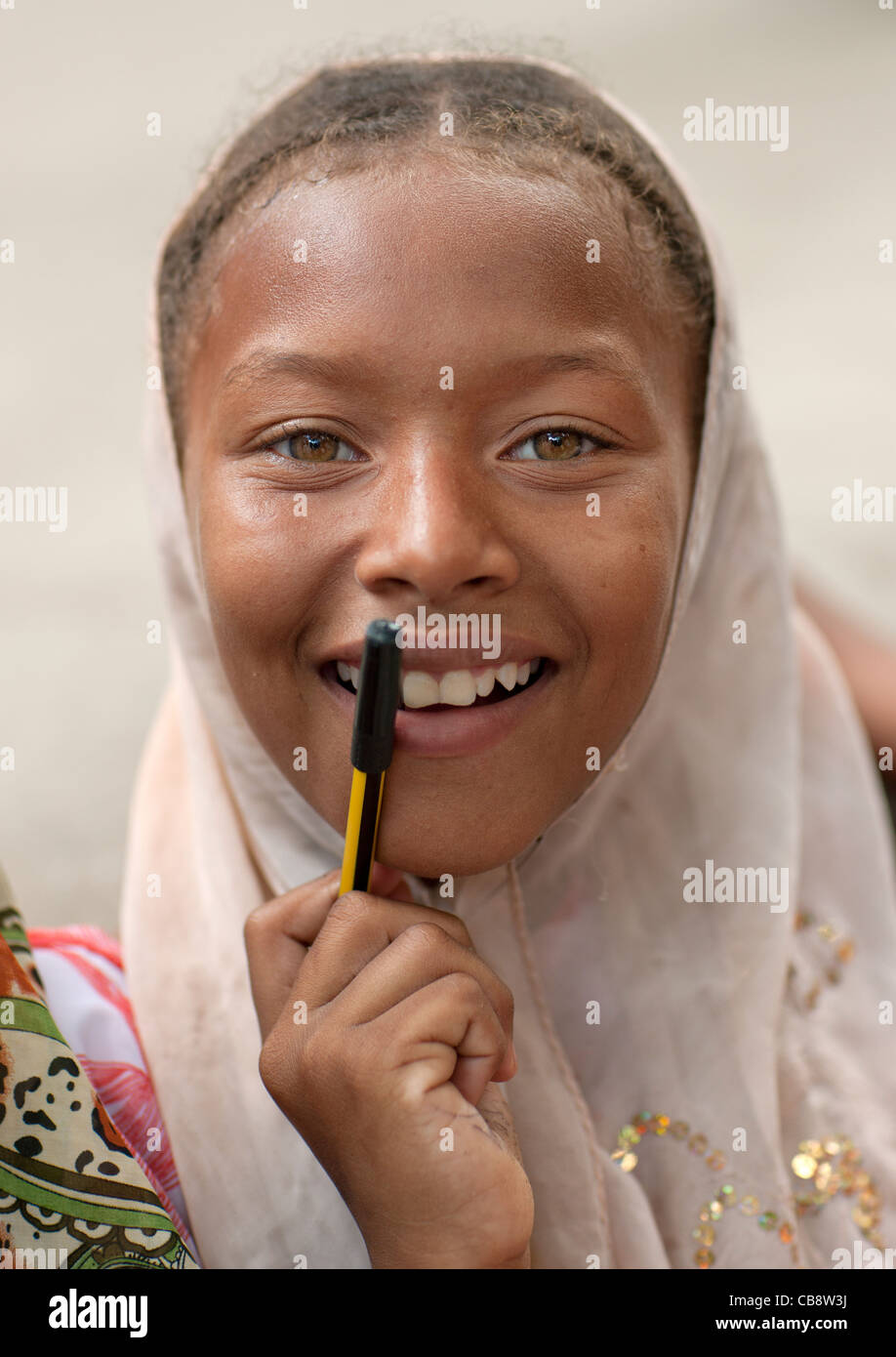 Cute Teenage Girl Smiling With Pen, Lamu, Kenya Stock Photo - Alamy