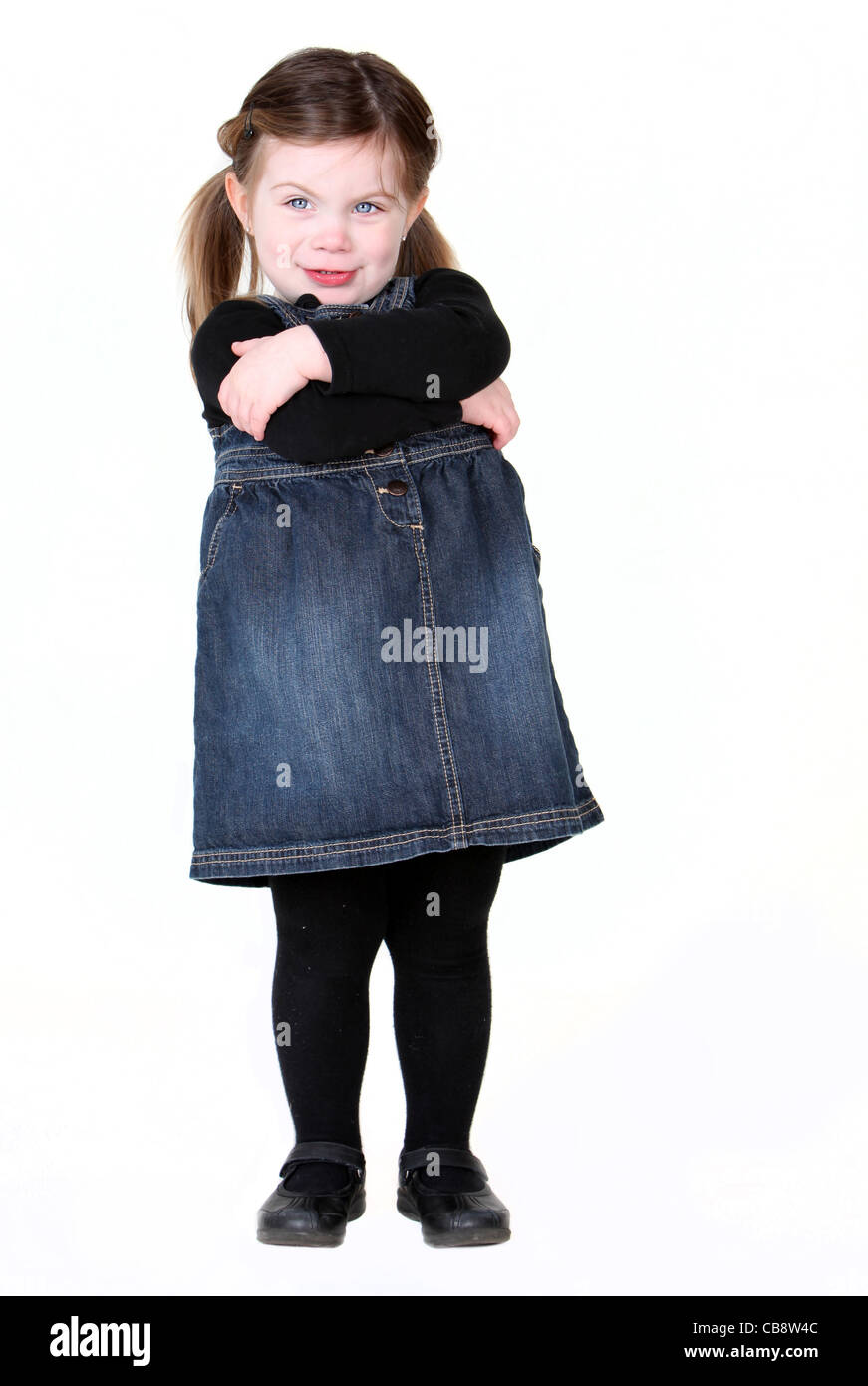 sassy child with arms folded on white with copyspace Stock Photo - Alamy