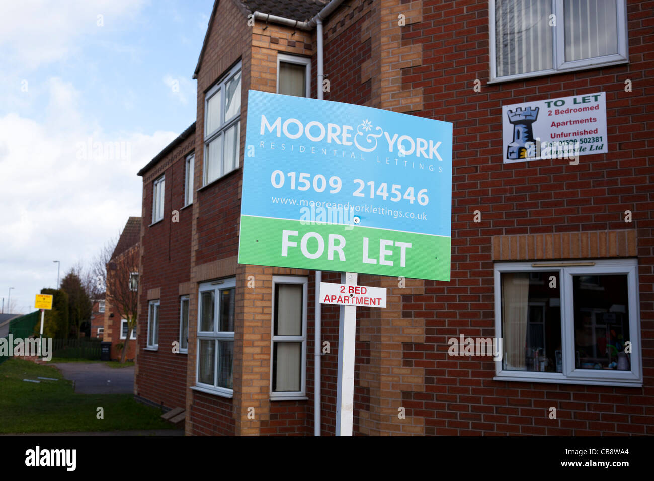 To let signs outside an apartment block Stock Photo - Alamy
