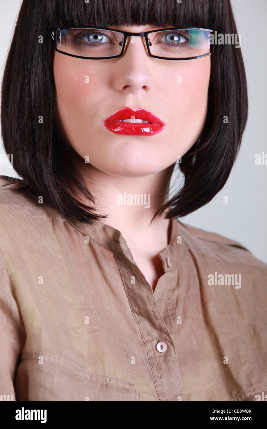 Serious woman with glasses Stock Photo - Alamy
