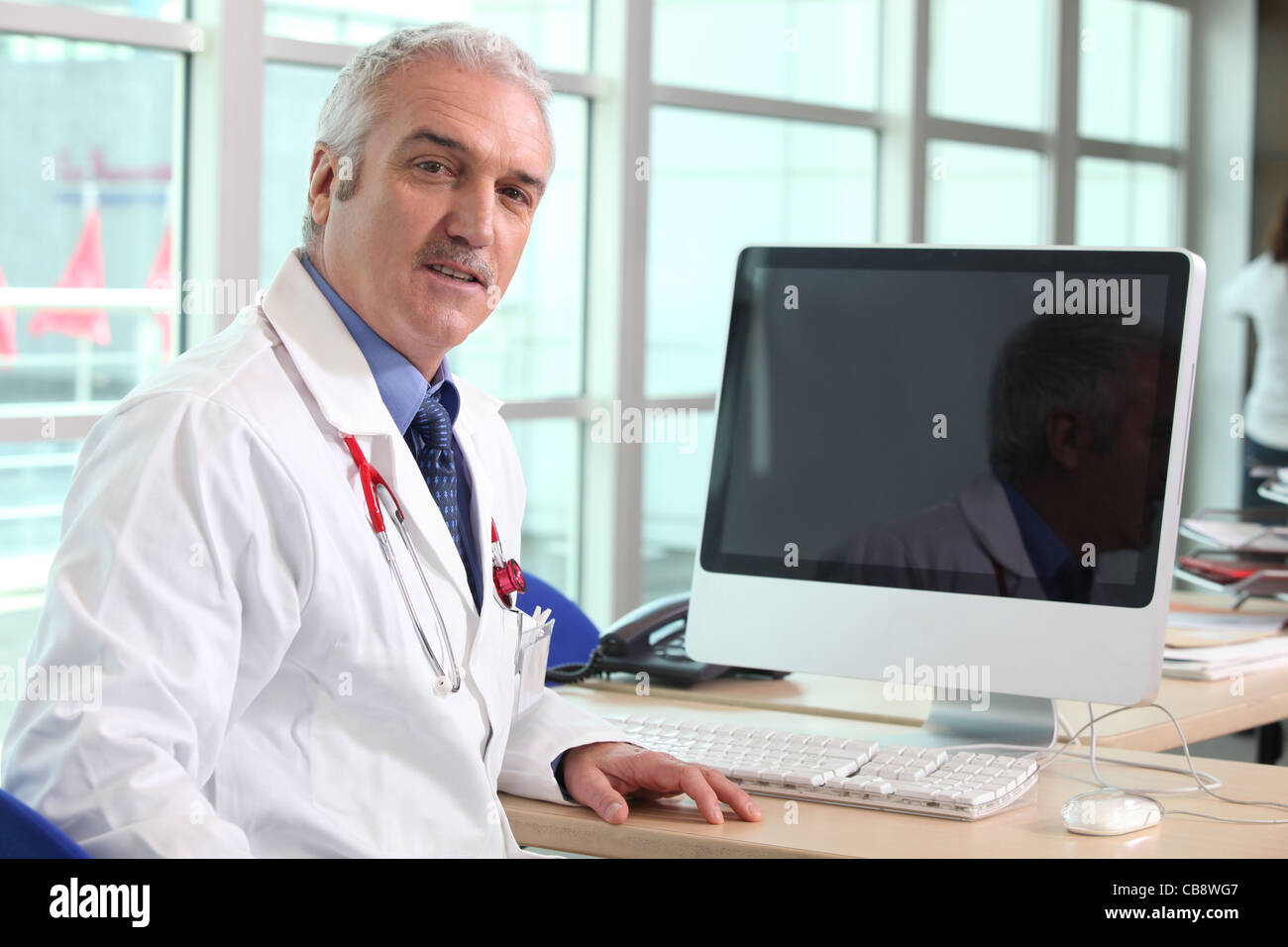 doctor at his desk Stock Photo - Alamy