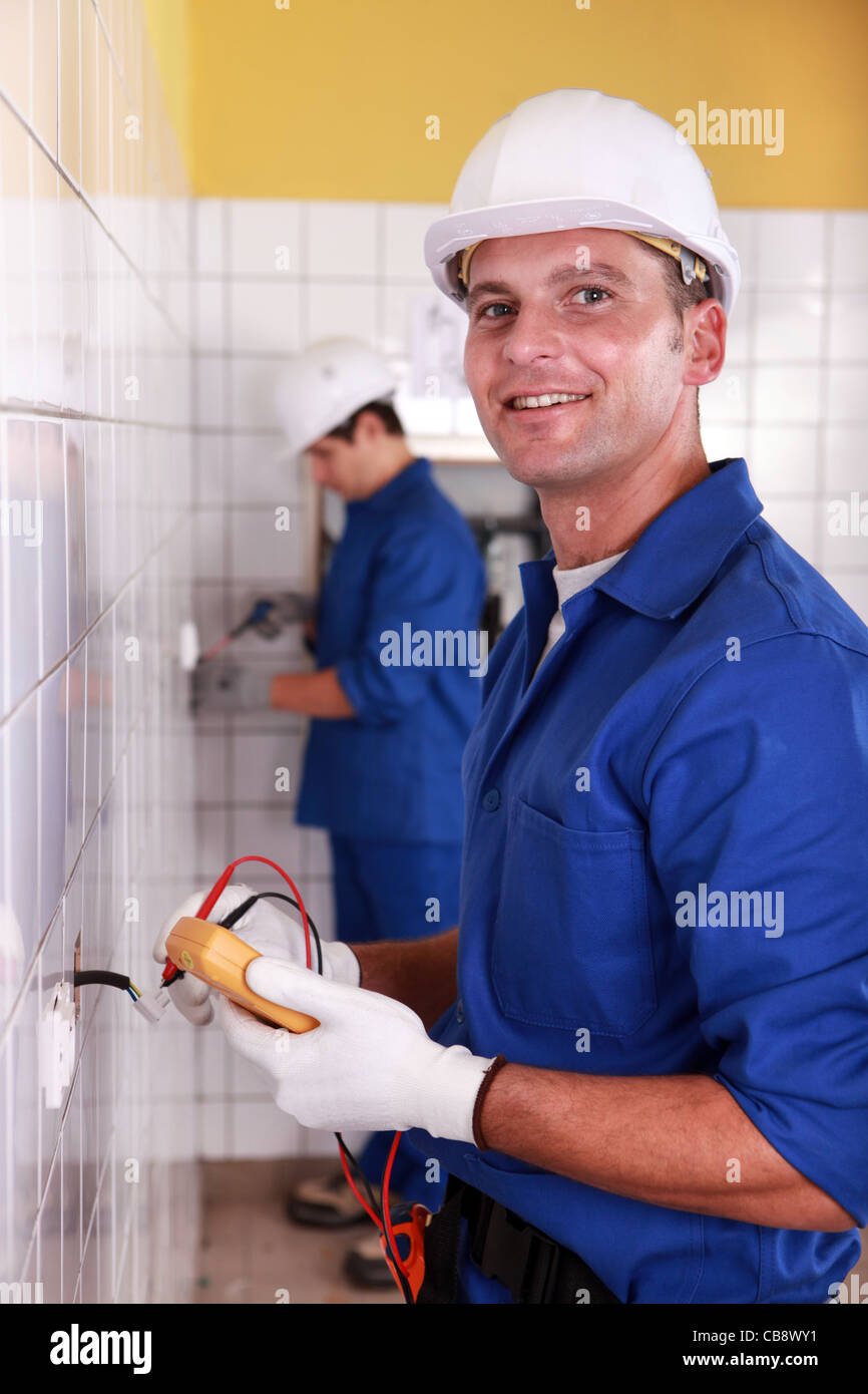 Worker performing an electrical test Stock Photo - Alamy