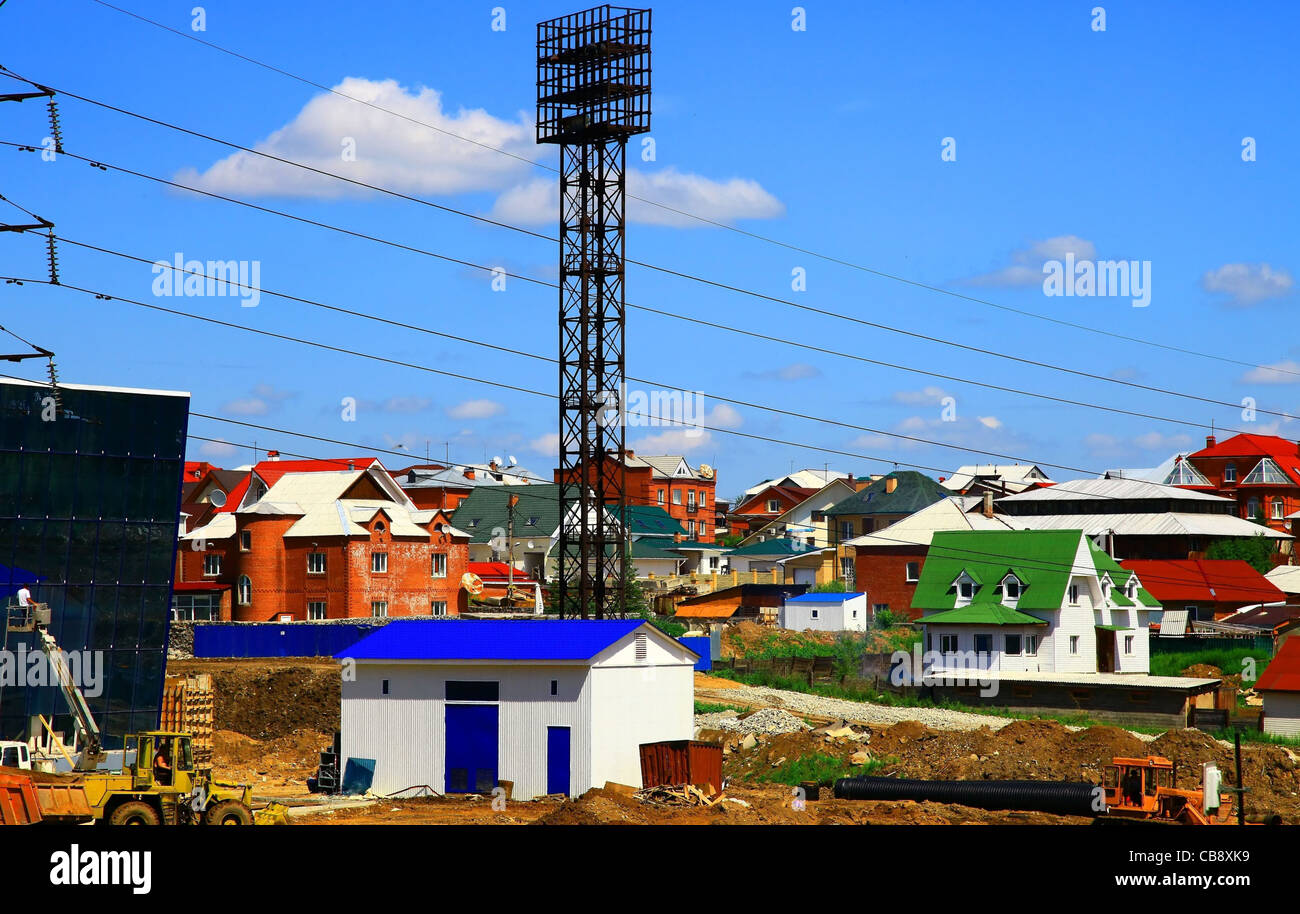 Construction place. Construction of the houses. Summer Stock Photo - Alamy