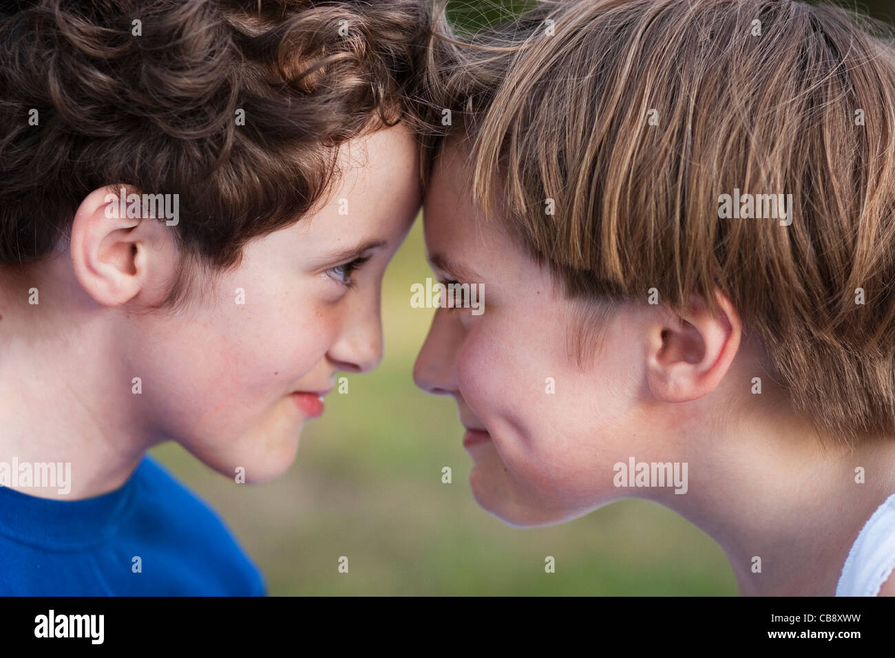 Two young girls facing-off Stock Photo - Alamy
