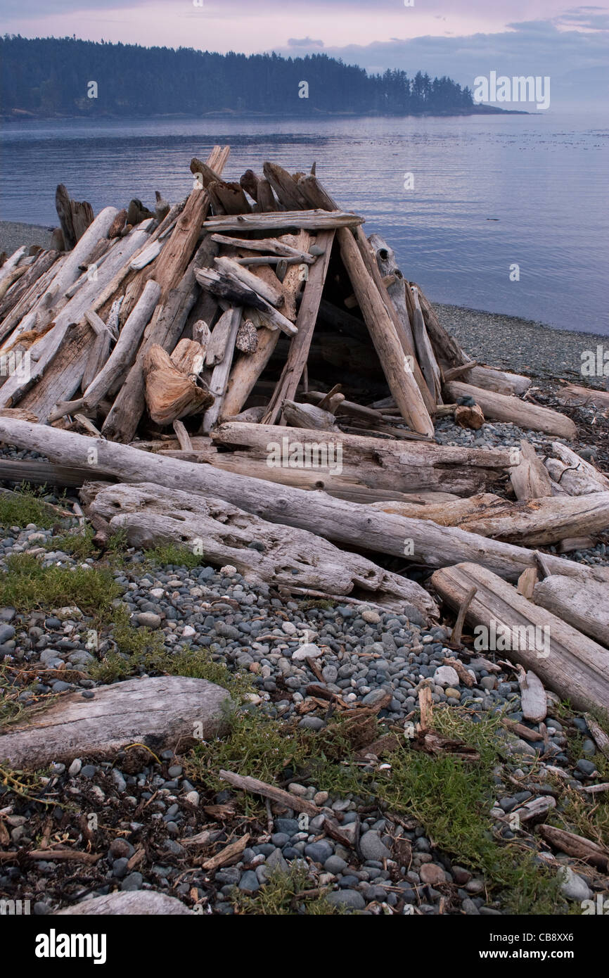Evening beach shot of a rustic lean-to structure on Victoria Island ...