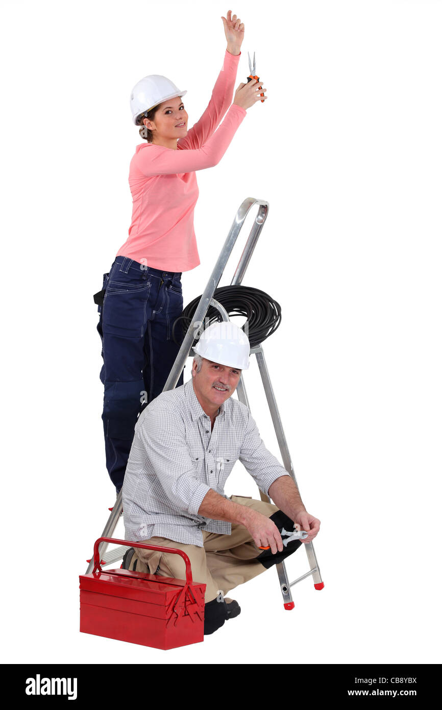 electricians working together Stock Photo - Alamy