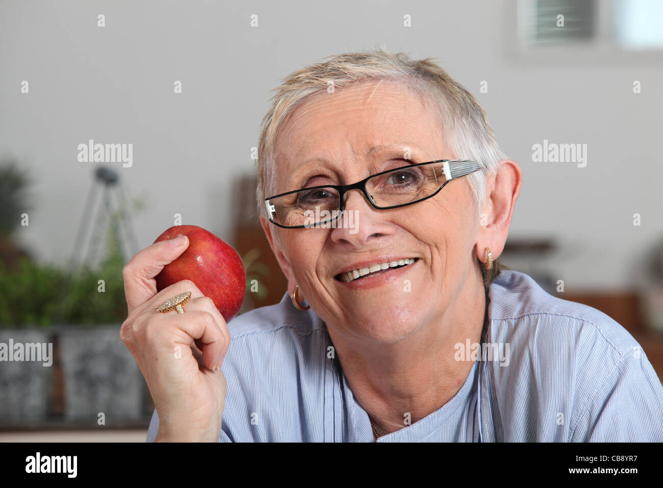 Old lady eating apple hi-res stock photography and images - Alamy