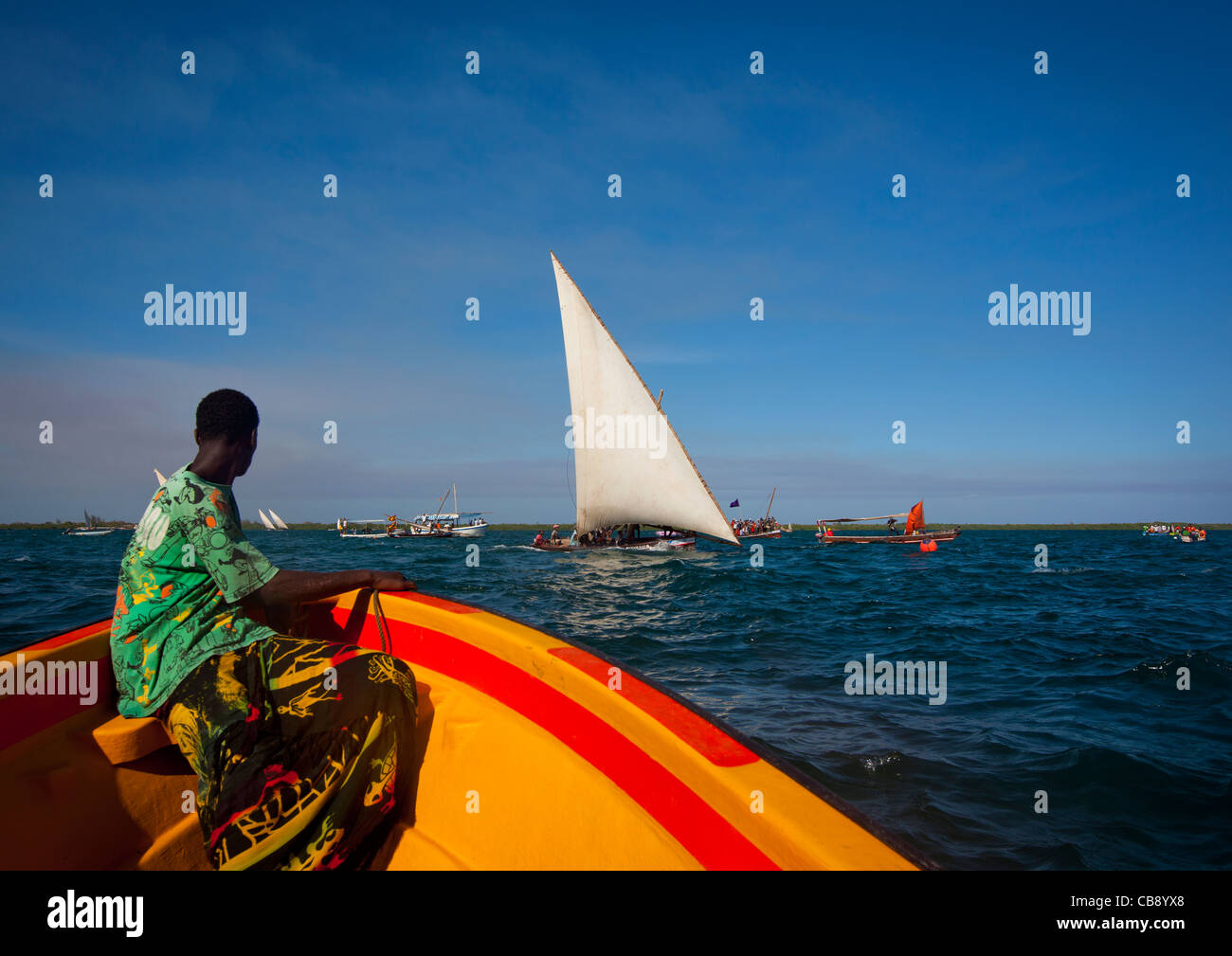 Man Watching The Dhow Race From Prow Of Observation Boat, Maulidi, Lamu ...