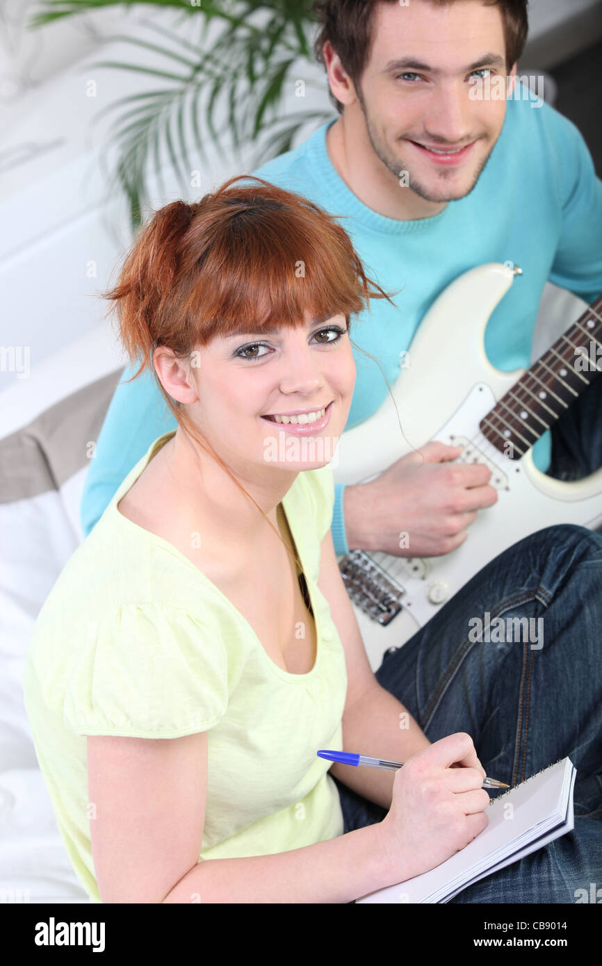 Couple writing song Stock Photo - Alamy